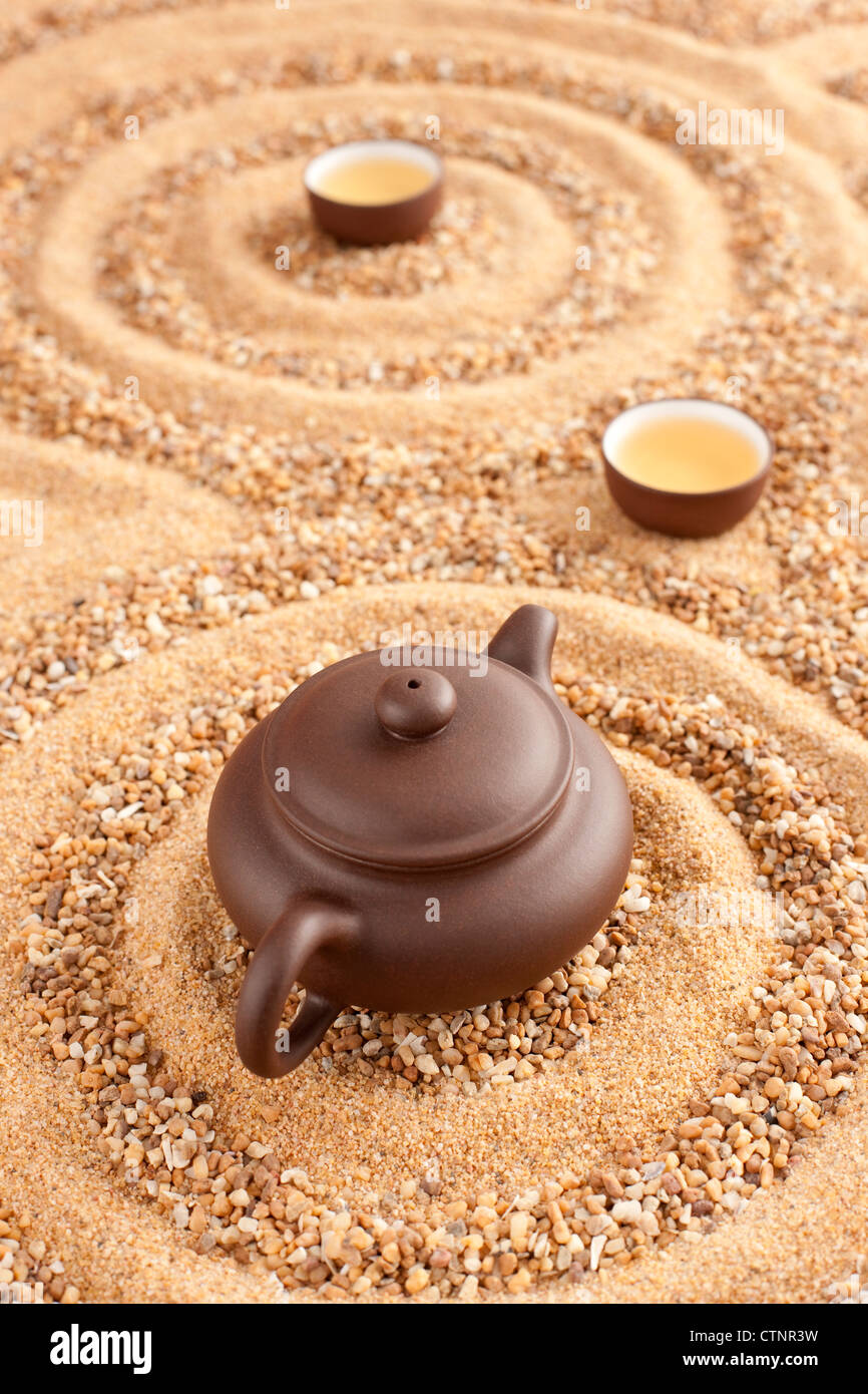 Tea set in sand Stock Photo - Alamy