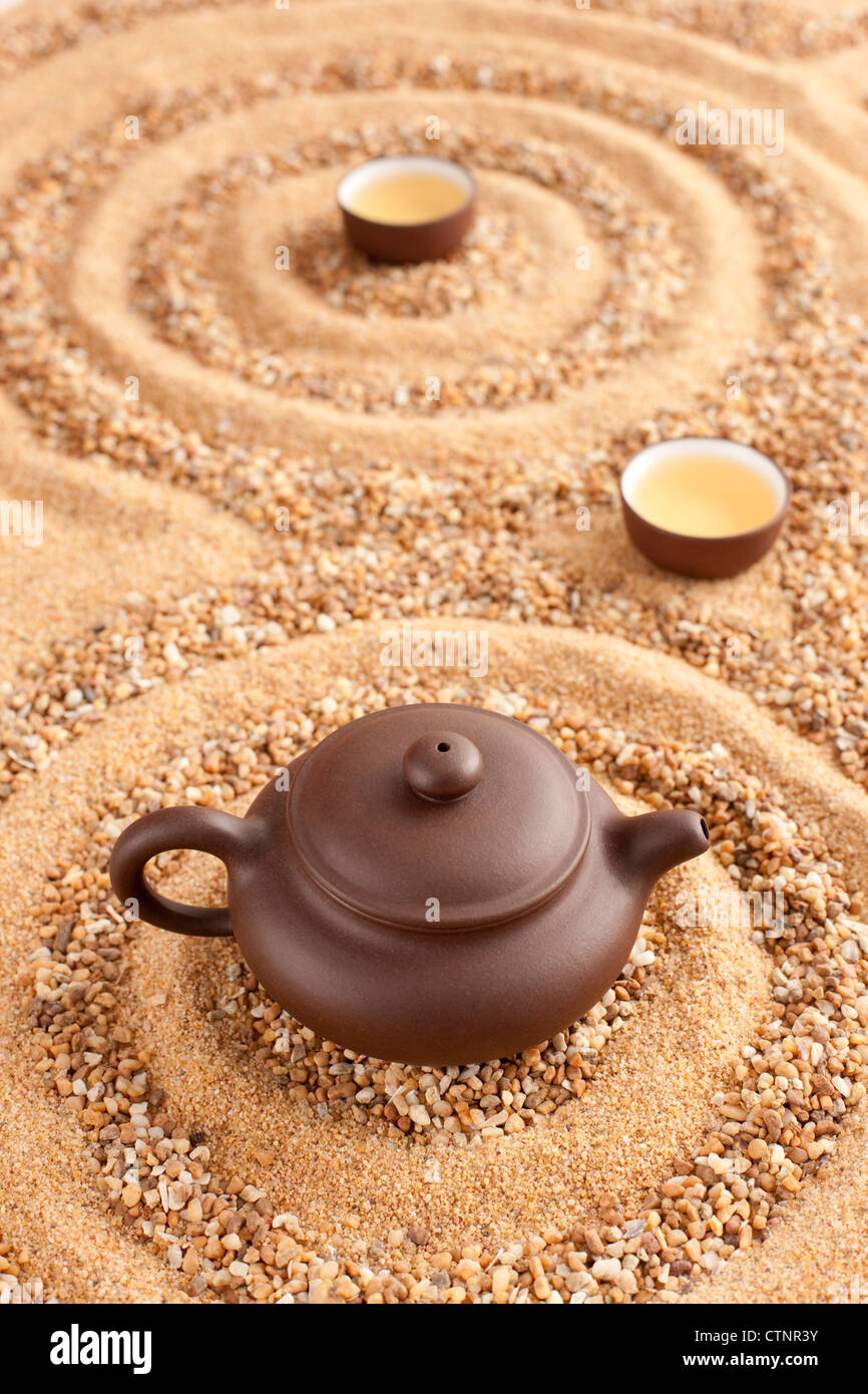 Tea set in sand Stock Photo - Alamy