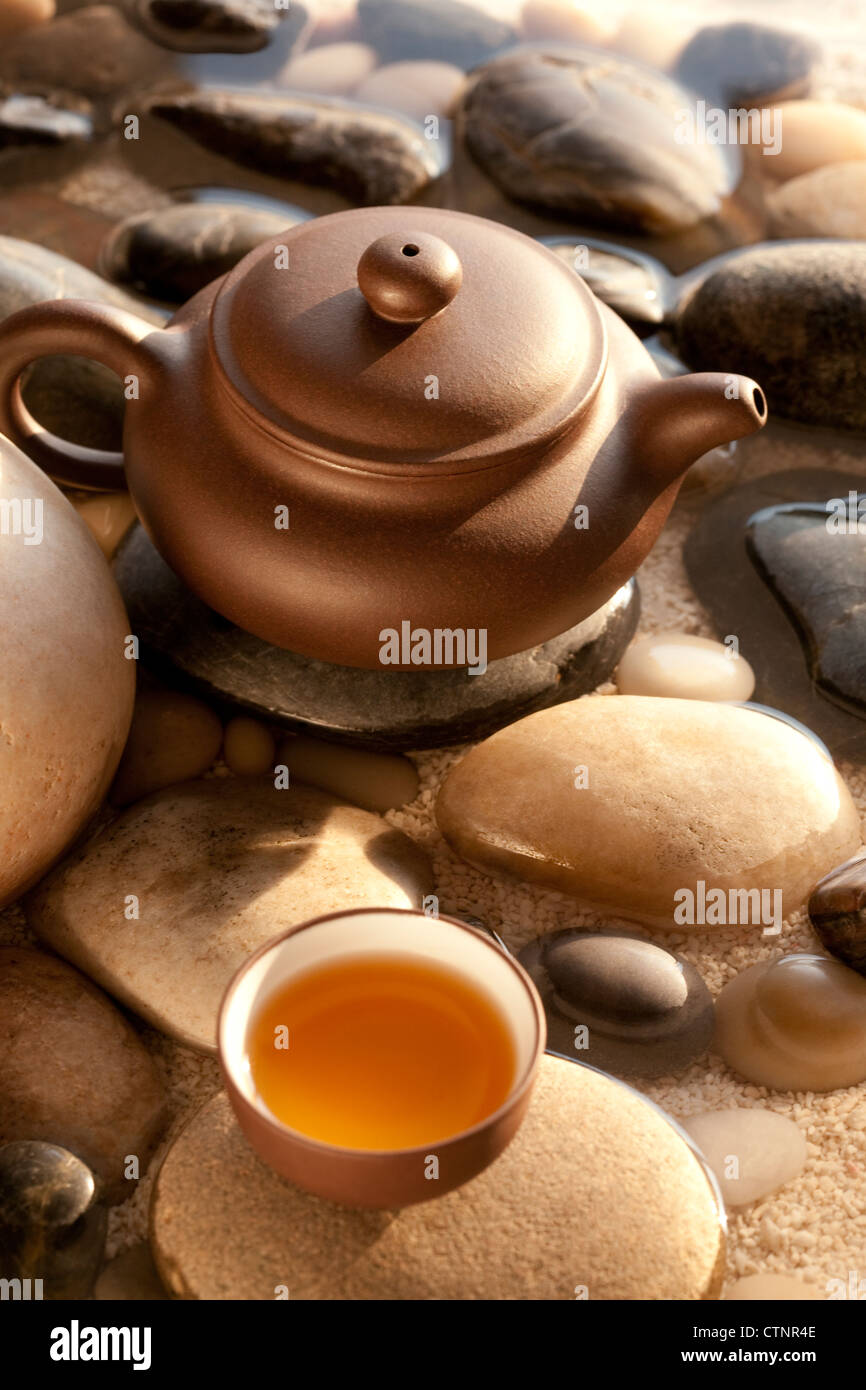 Tea set and pebbles Stock Photo - Alamy