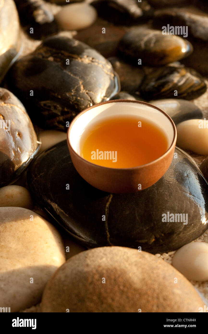 Tea and pebbles Stock Photo - Alamy