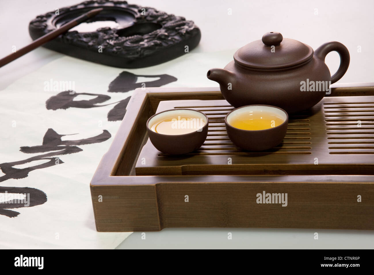 Tea set and Chinese calligraphy Stock Photo - Alamy