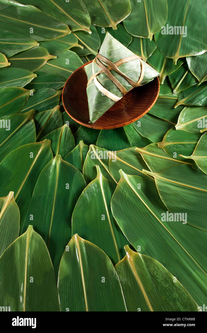 Zongzi and Zongzi leaves Stock Photo - Alamy