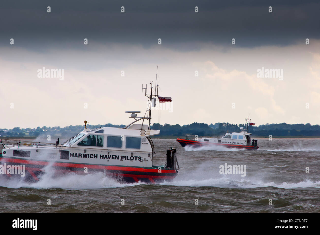 Harwich haven pilot cutter boat leaving port Stock Photo - Alamy