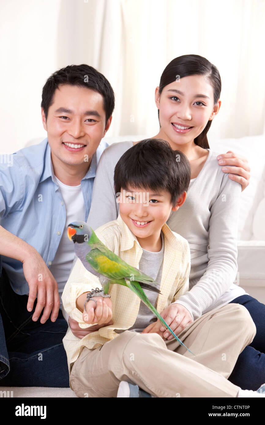 Family with pet Parrot Stock Photo - Alamy