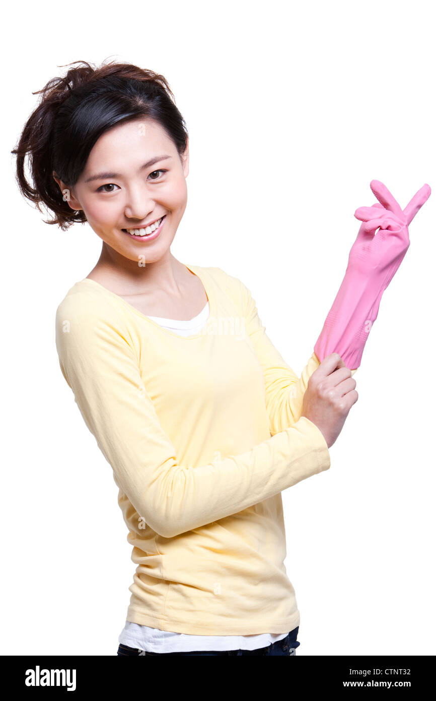 Housewife wearing washing up glove Stock Photo - Alamy