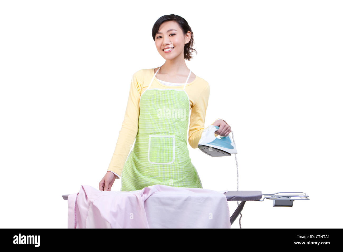 Housewife doing ironing Stock Photo - Alamy