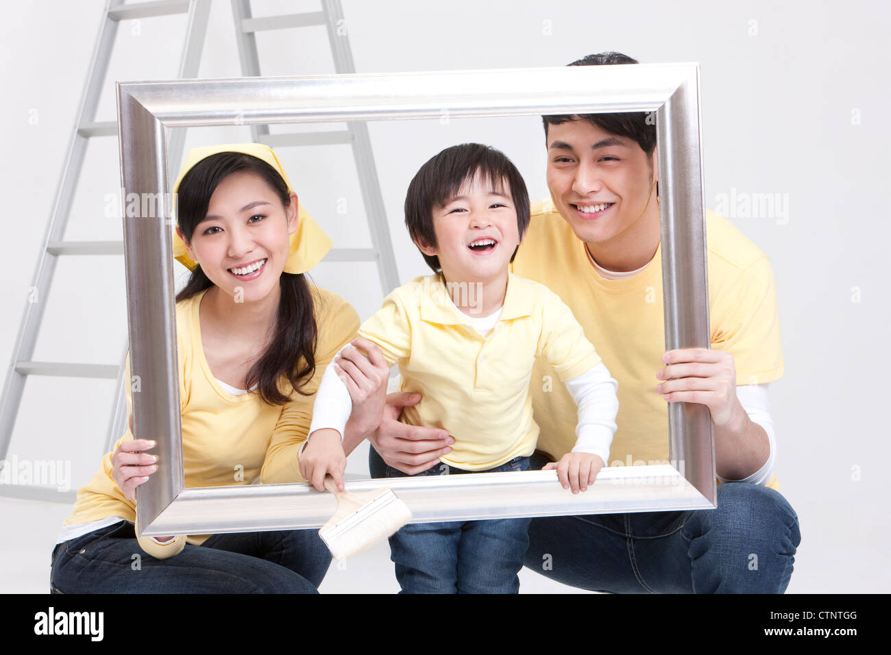 Young family doing home DIY Stock Photo - Alamy