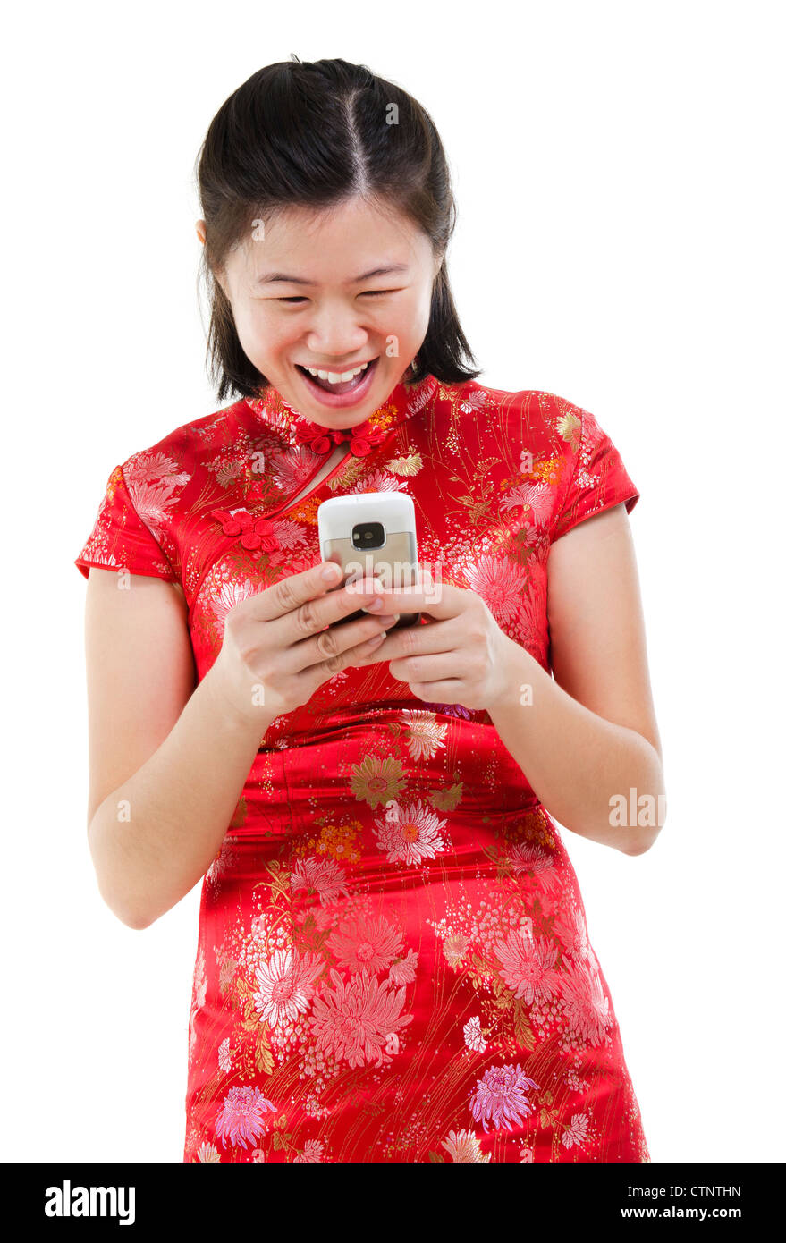 Happy oriental Asian woman using mobile phone to online / texting / sms ...