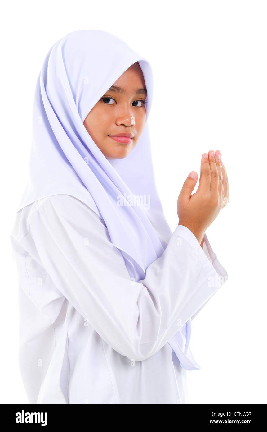 Southeast Asian youth Muslim prayer praying over white background Stock ...