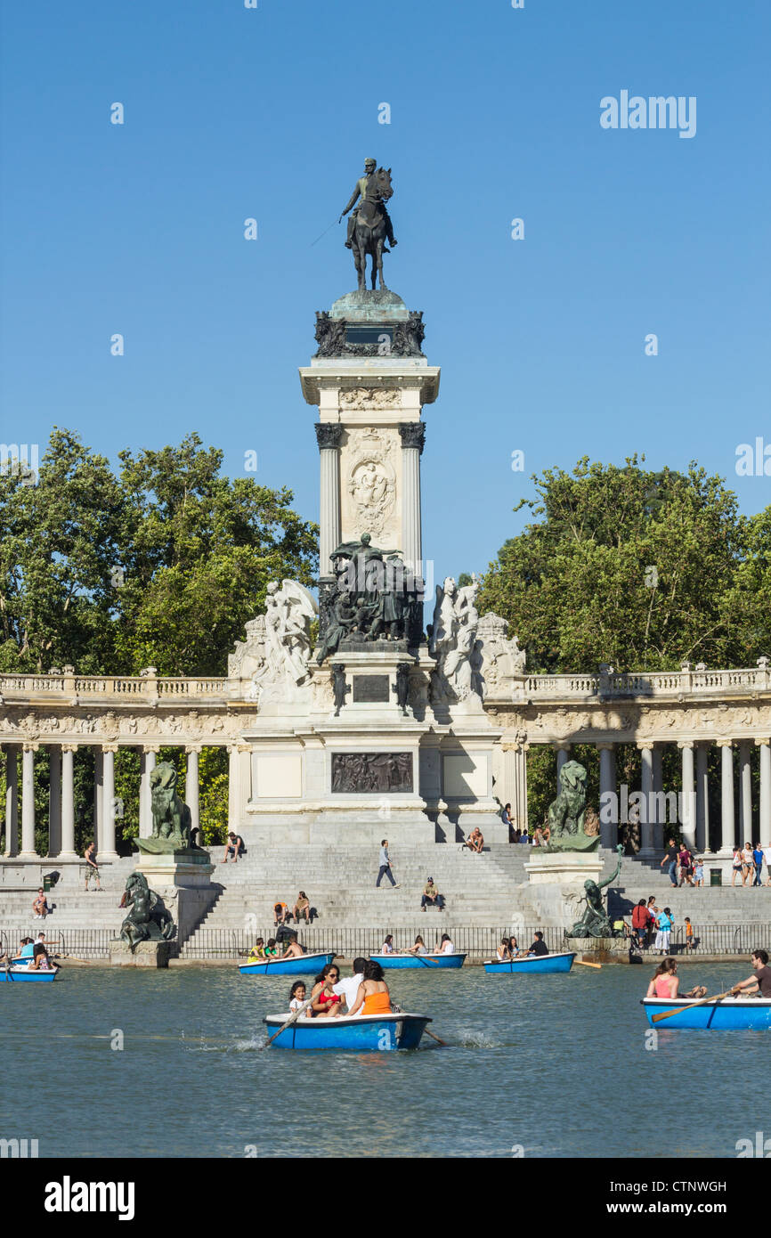 Boating lake in Retiro park in Madrid, Spain. Monument to King Alfonso ...