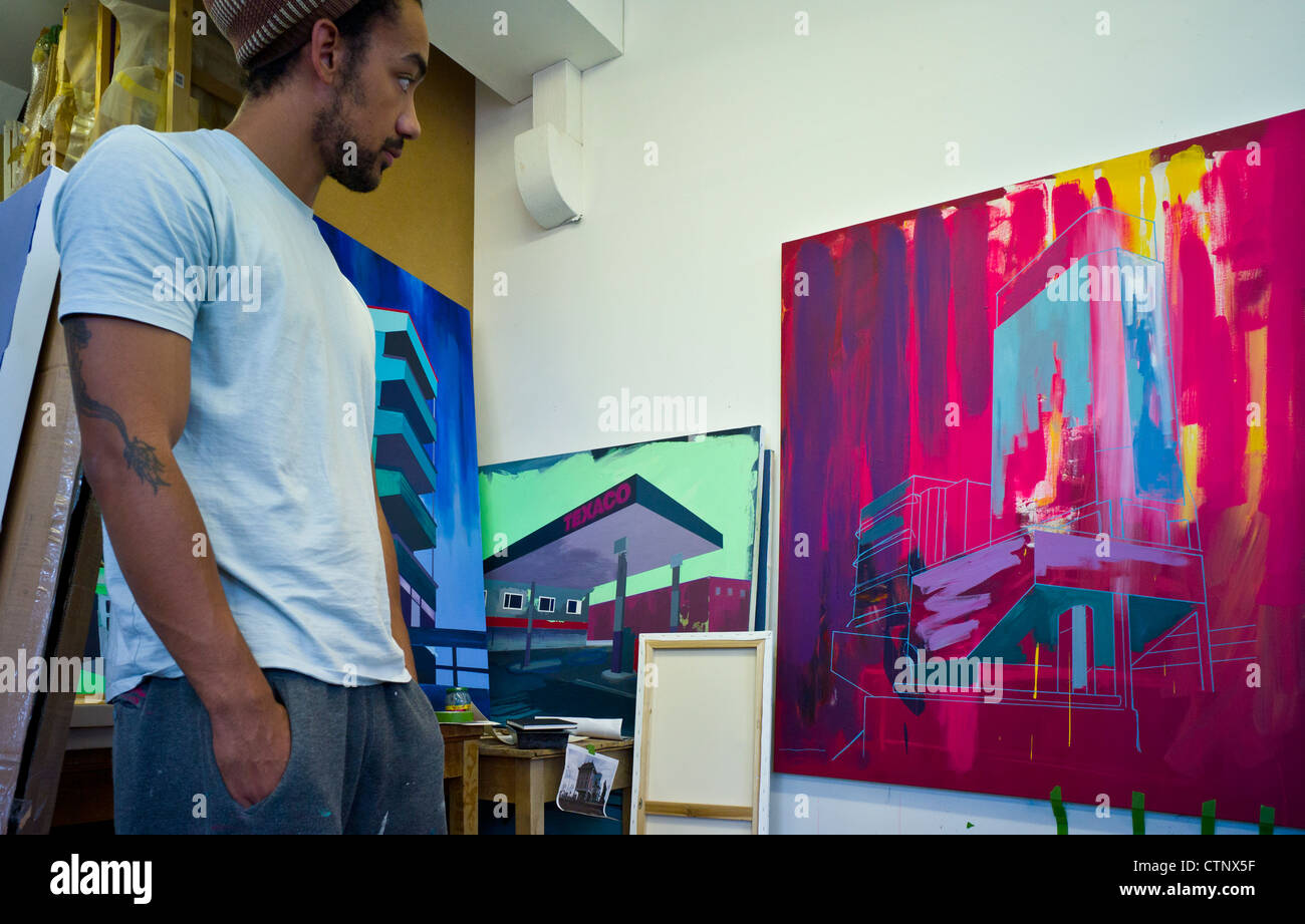 An artist studies a painting in progress Stock Photo - Alamy