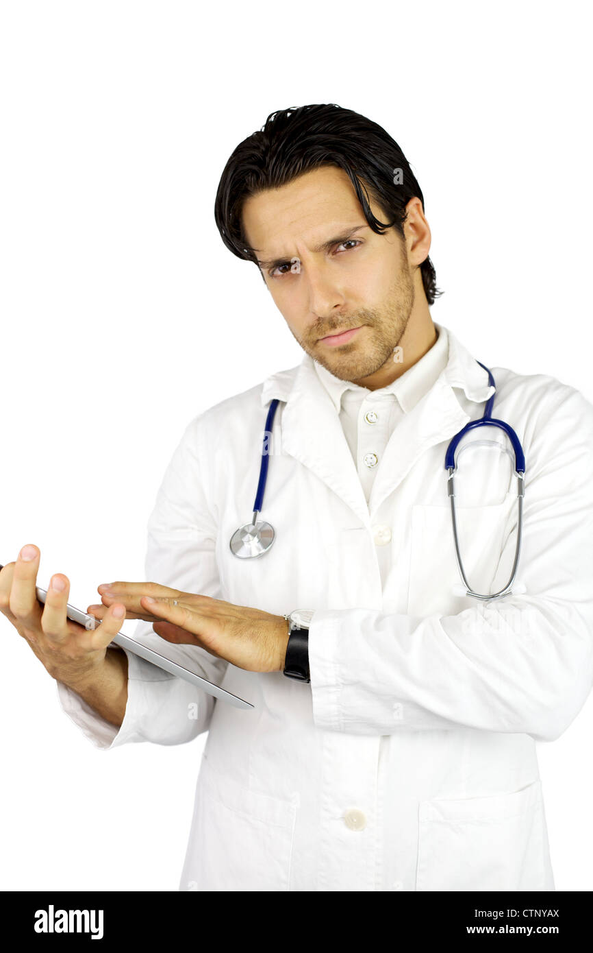Cool handsome doctor looking while working with tablet ipad Stock Photo ...