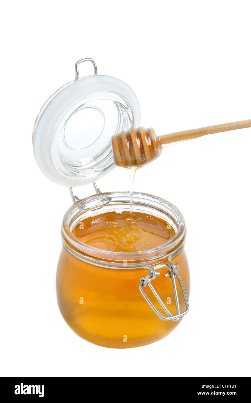 Open jar of honey and drizzler isolated Stock Photo - Alamy