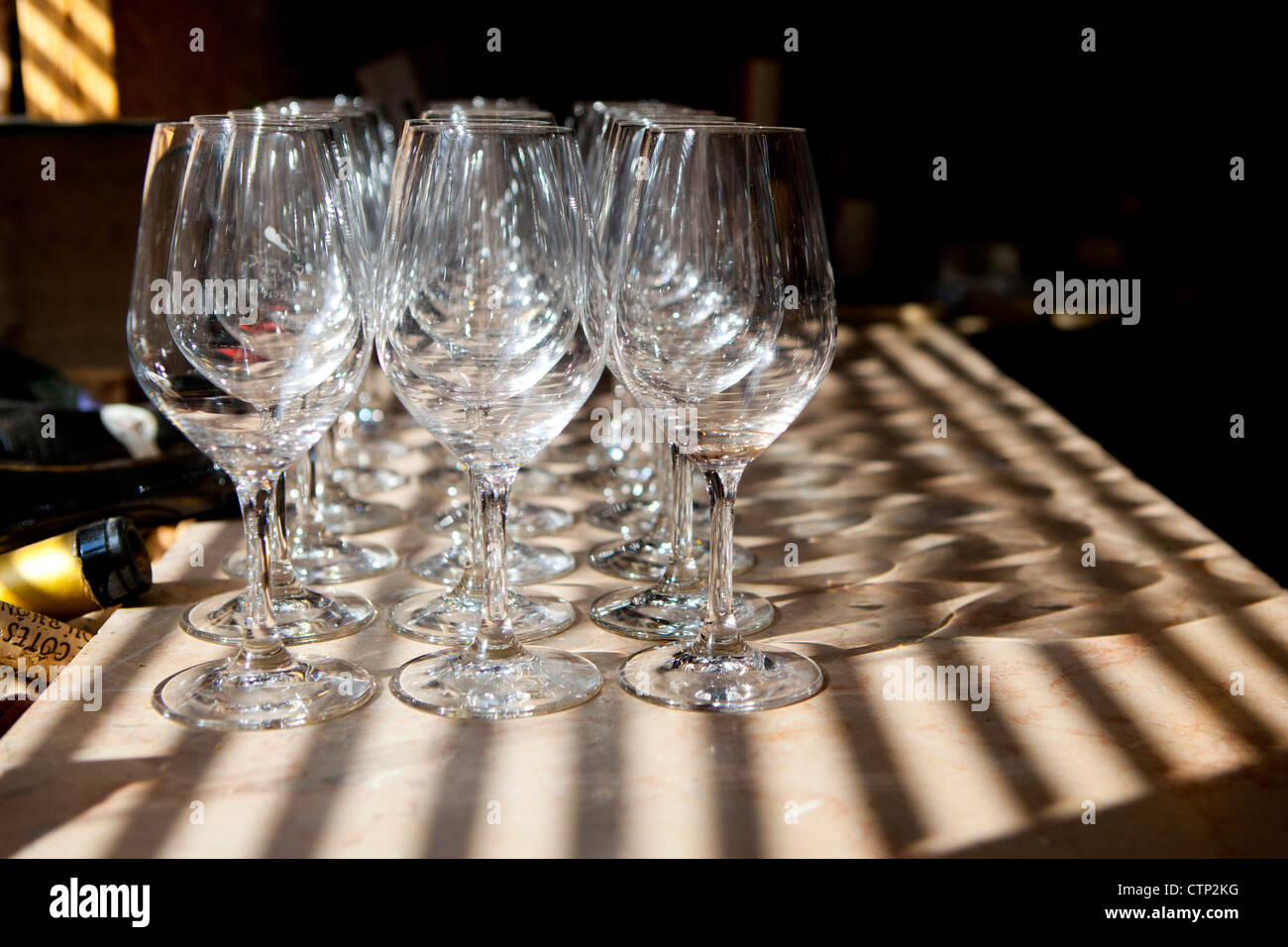Light shinning through the window onto wine glasses, at a wine shop in ...