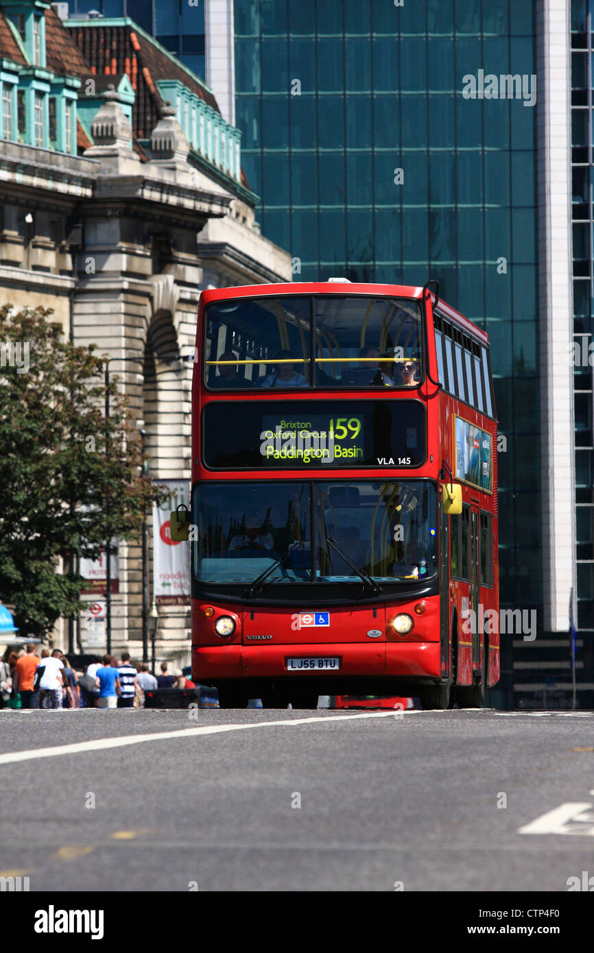 a double decker red London bus traveling on a road in London Stock ...