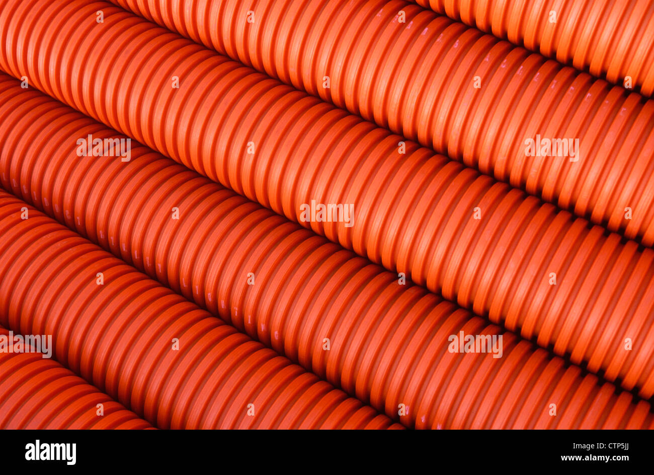 Stockpile of ribbed flexible plastic pipes Stock Photo - Alamy