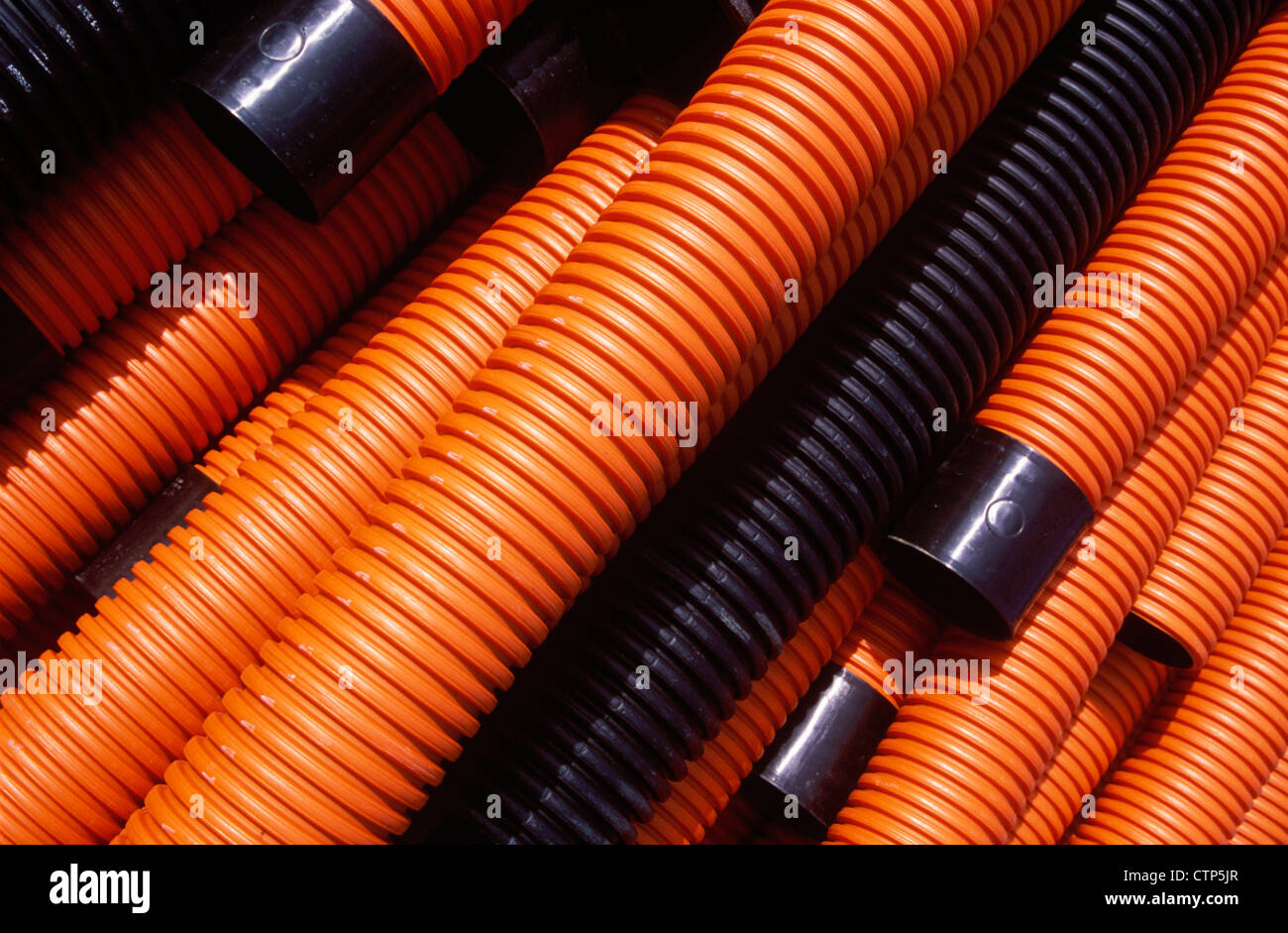 Stockpile of ribbed plastic pipes Stock Photo - Alamy