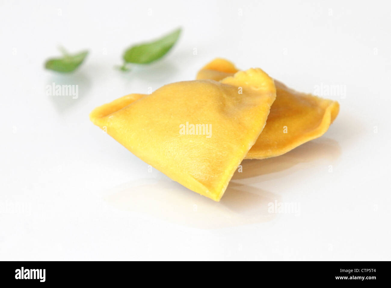 Fresh uncooked Ravioli (Stuffed Pasta) on white background Stock Photo ...