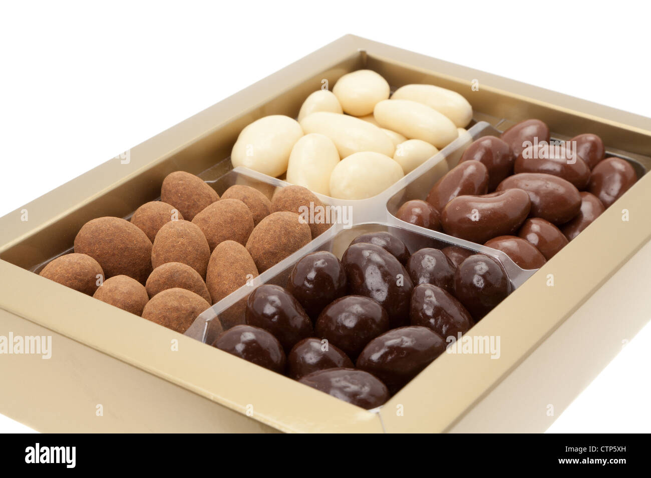 A selection box of chocolate coated Brazil nuts - shallow depth of ...