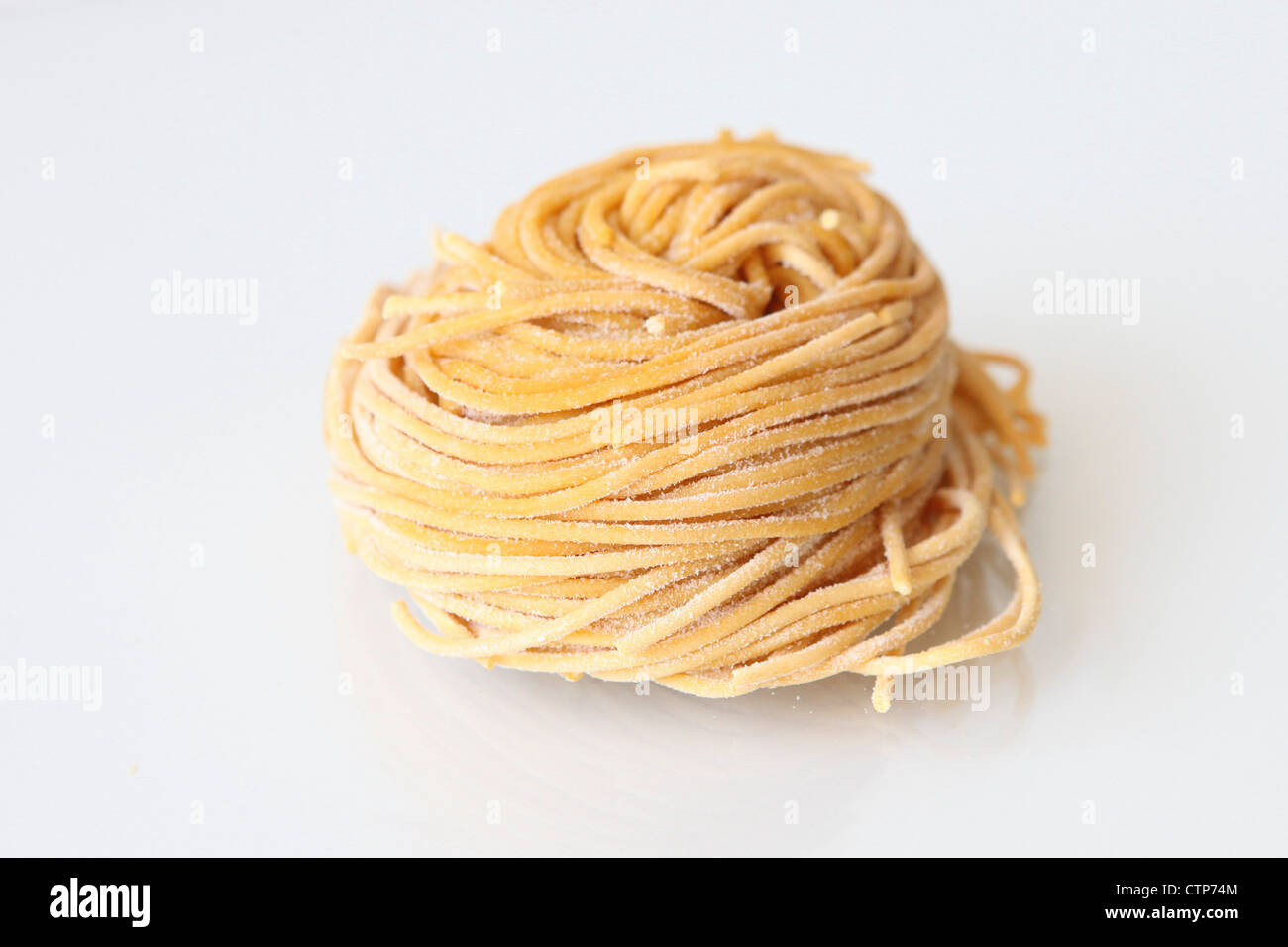 Fresh Spaghetti on white background Stock Photo - Alamy