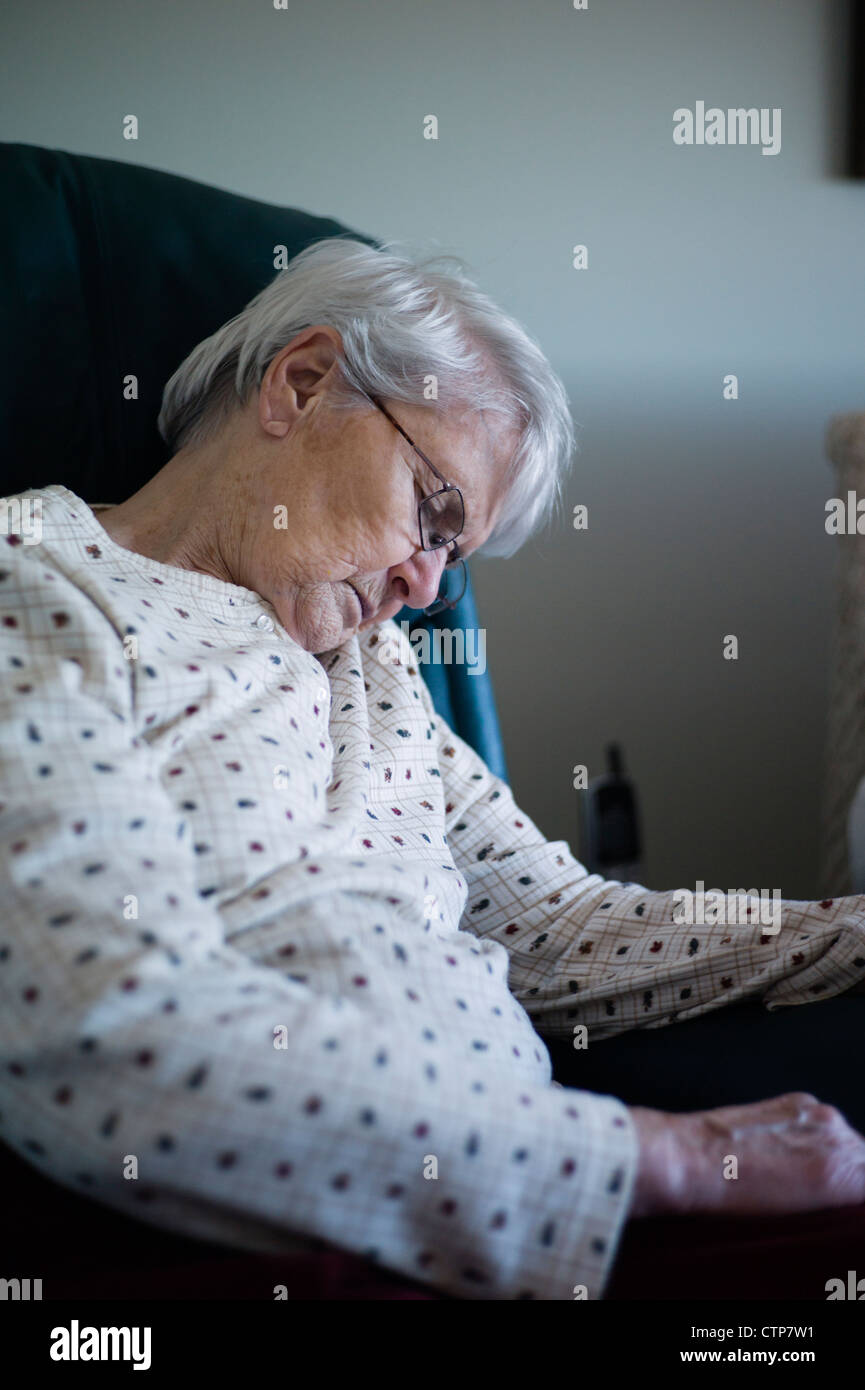 Old woman asleep in chair hi-res stock photography and images - Alamy