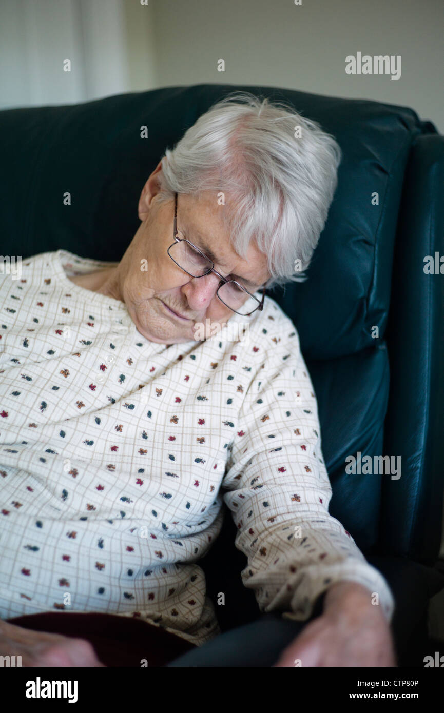 Elderly woman asleep in chair hi-res stock photography and images - Alamy