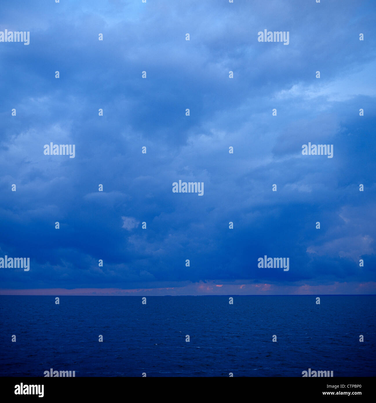 Stormy clouds and rain over a lake Stock Photo - Alamy