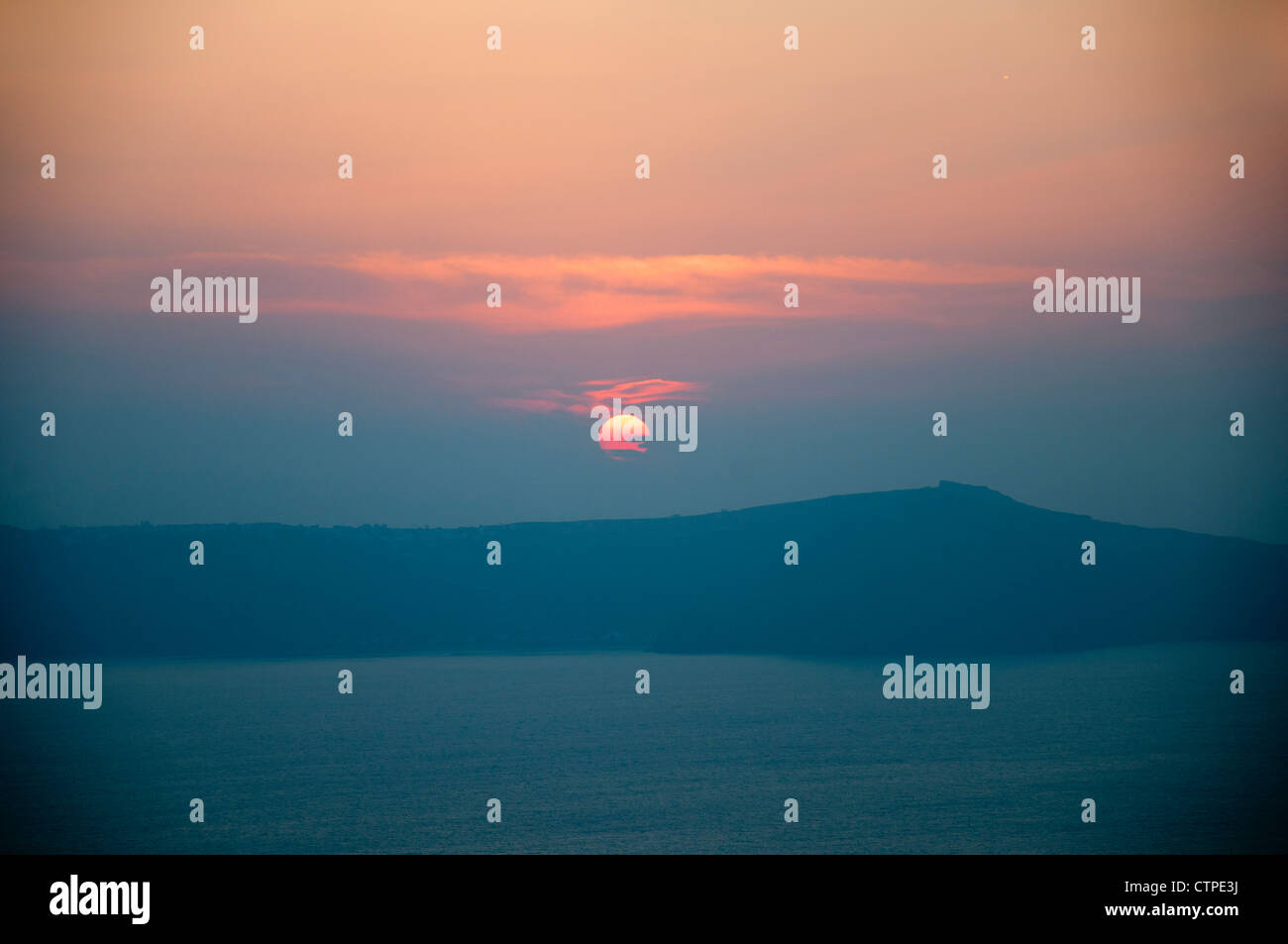 Sunset at Fira the Capital town on the island of Santorini in the ...