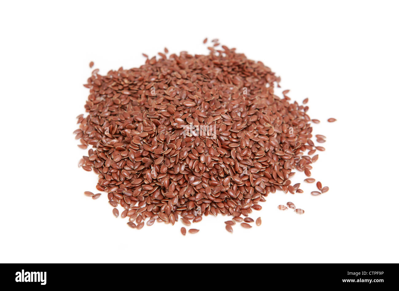 many seeds of common flax on white background Stock Photo - Alamy