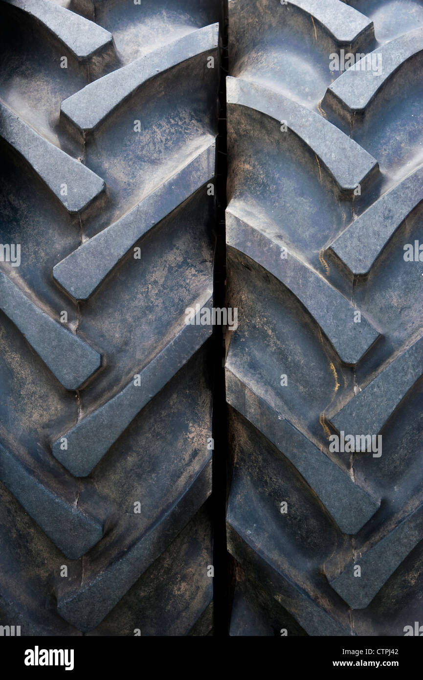 Two tires/tyres on a vintage tractor, arranged in pairs on the rear ...