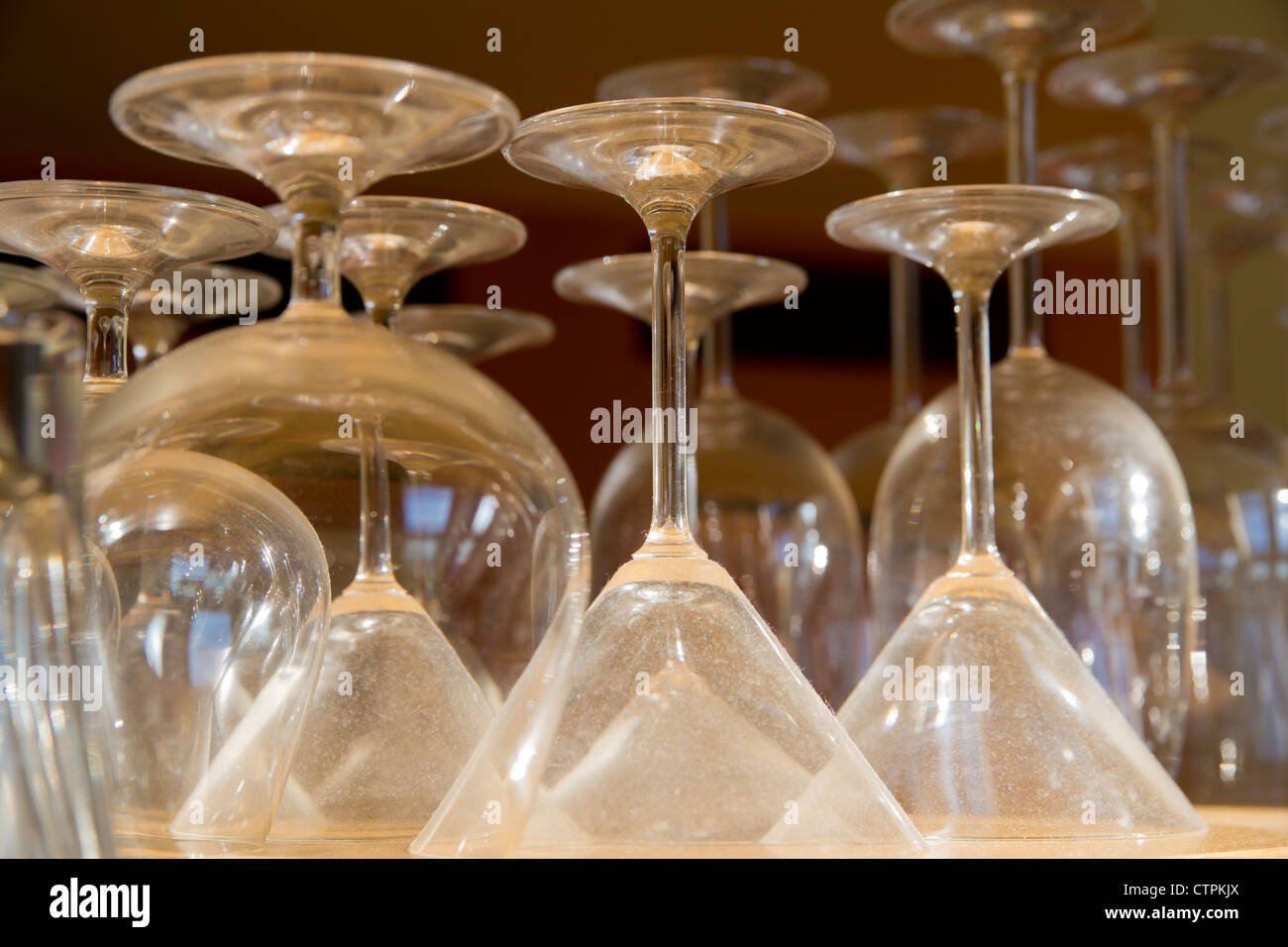 Empty different shape goblets stay on special shelf Stock Photo - Alamy