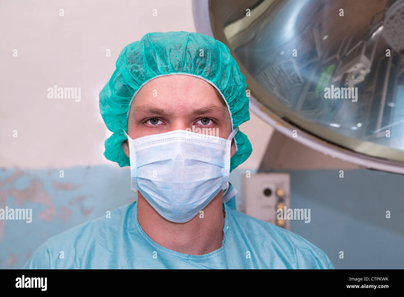 Surgeon seems very serious about coming difficult surgery Stock Photo ...
