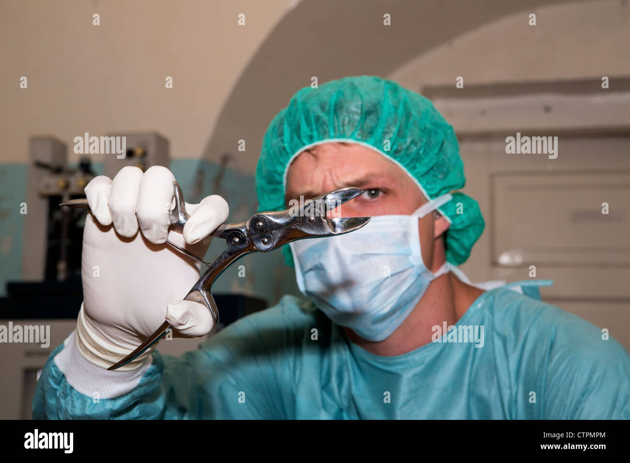 Surgeon show strange tool before coming difficult surgery Stock Photo ...