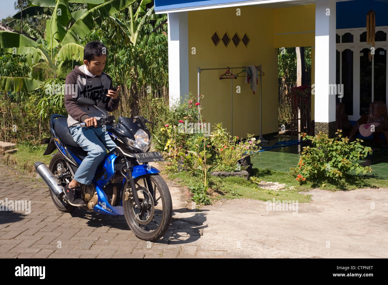 Youth riding motorcycle hi-res stock photography and images - Alamy