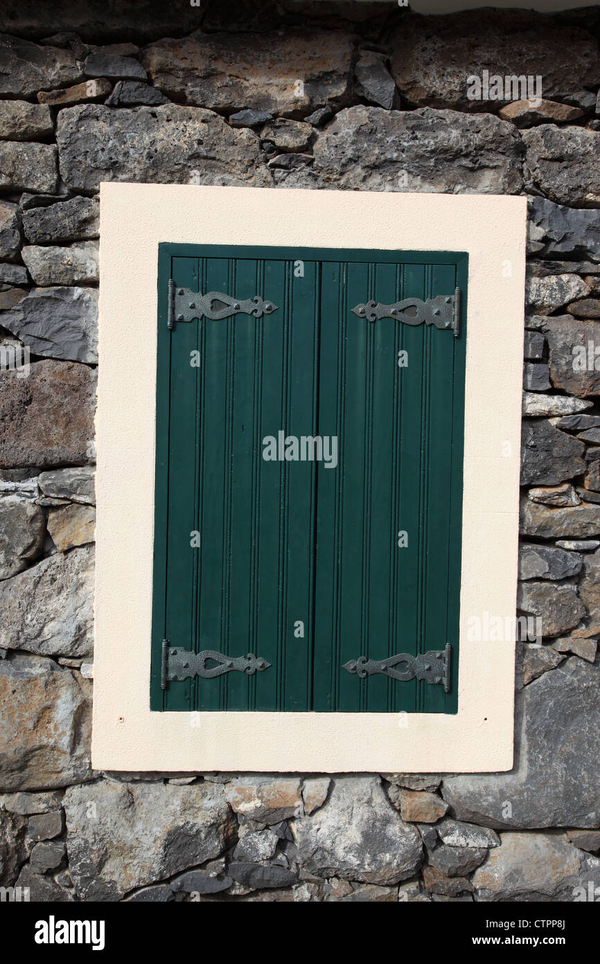 traditional field stone wall and window in building at Madeira ...