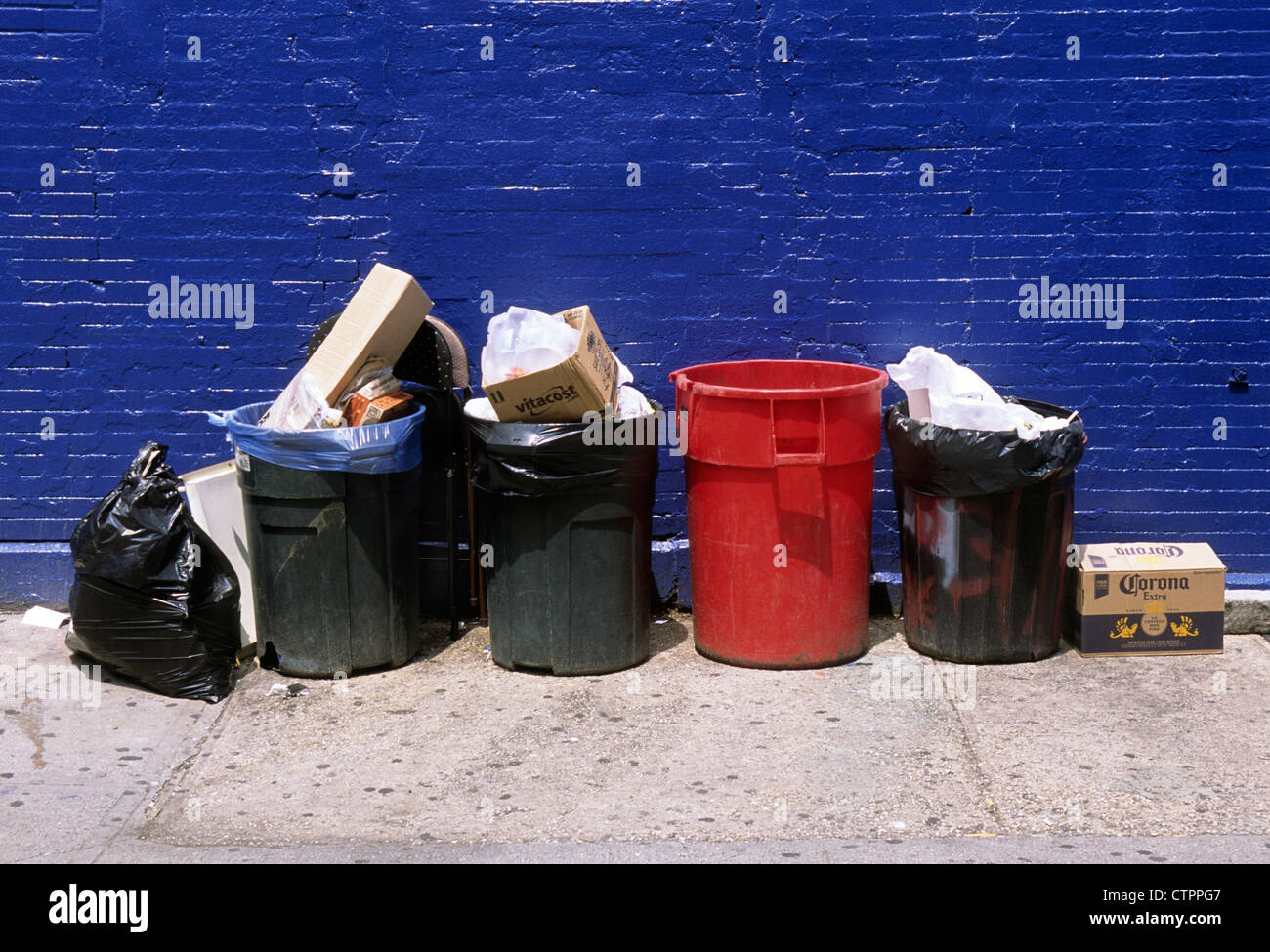 Waste collection. Garbage or rubbish waiting for pick-up on the street ...
