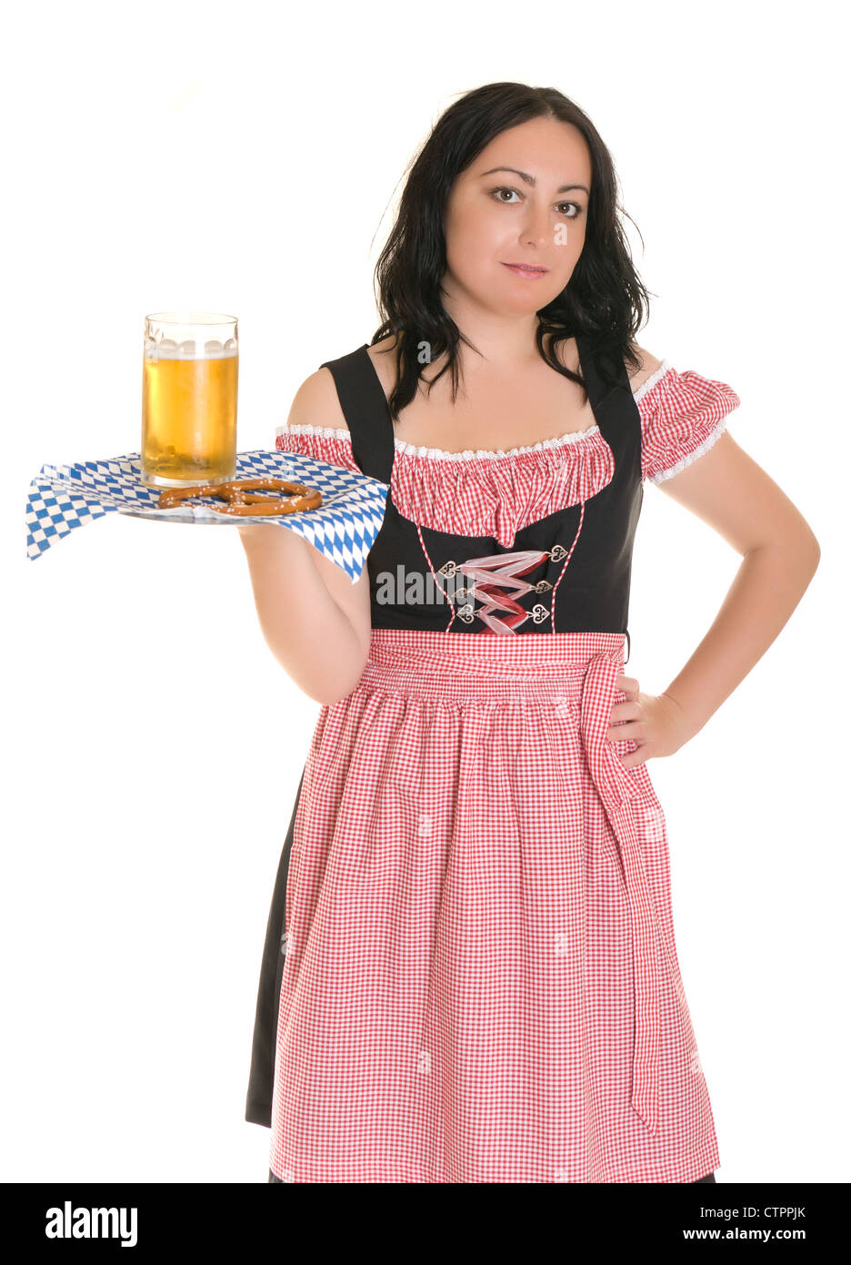 The waitress from Bavaria in the traditional dress has a beer and ...