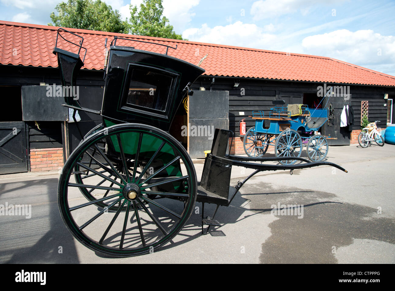 Antique horse carriage in stables, Stanwell Moor, Surrey, England ...