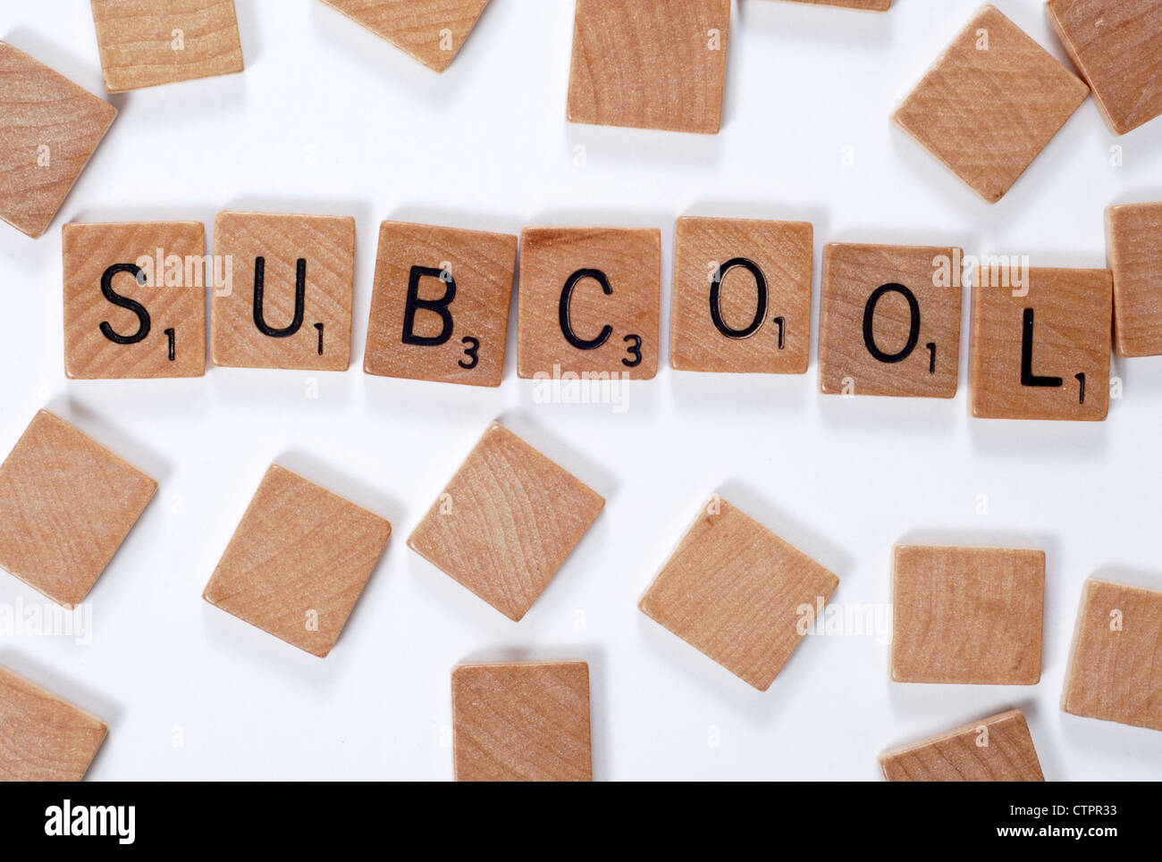 A new dictionary word: Subcool, spelled out with wooden tiles Stock ...