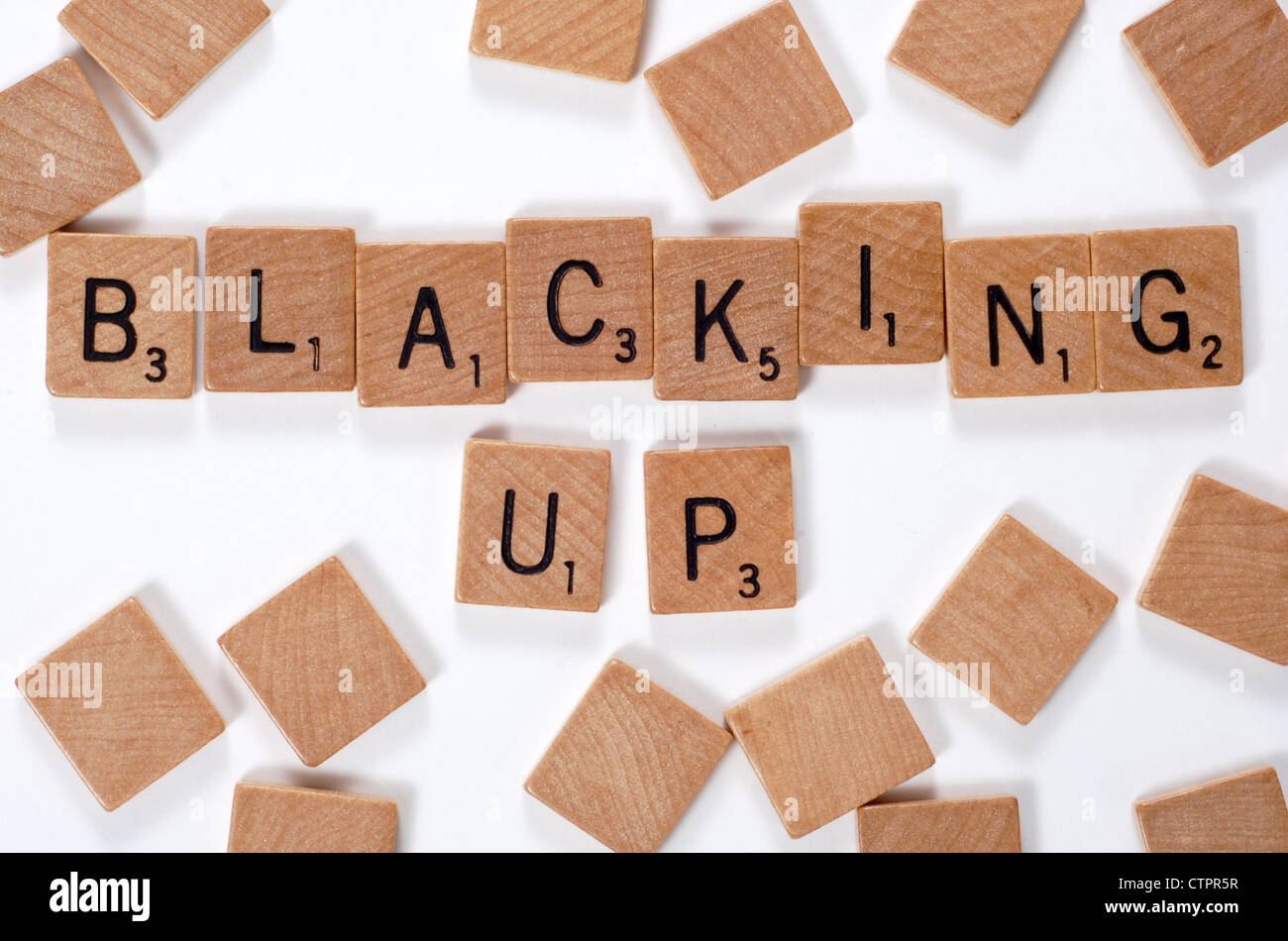 A new dictionary word: Blacking Up, spelled out with wooden tiles Stock ...