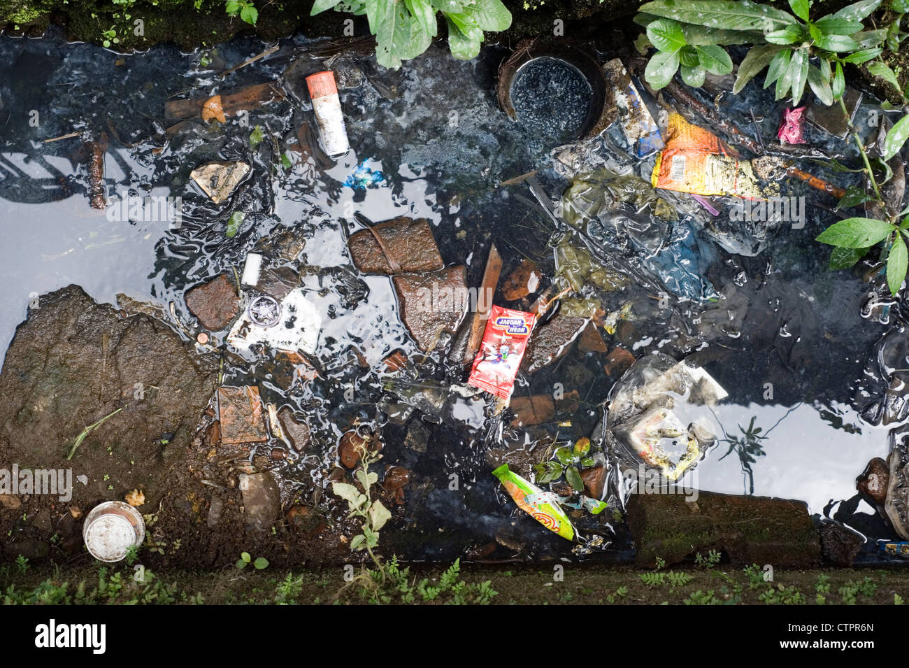dirty polluted water in small stream in rural village java indonesia ...