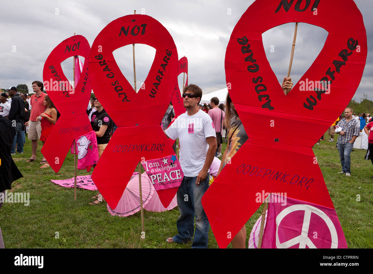 People holding HIV AIDS awareness ribbons - July 22, 2012, Washington ...