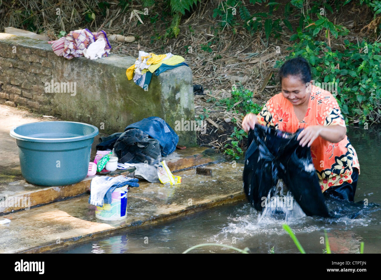 local village woman doing laundry in river java indonesia Stock Photo ...
