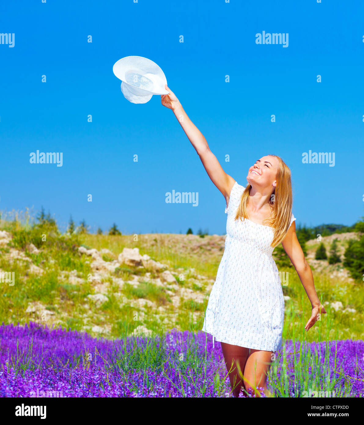 Cute girl dancing on lavender field, beautiful happy woman enjoying ...