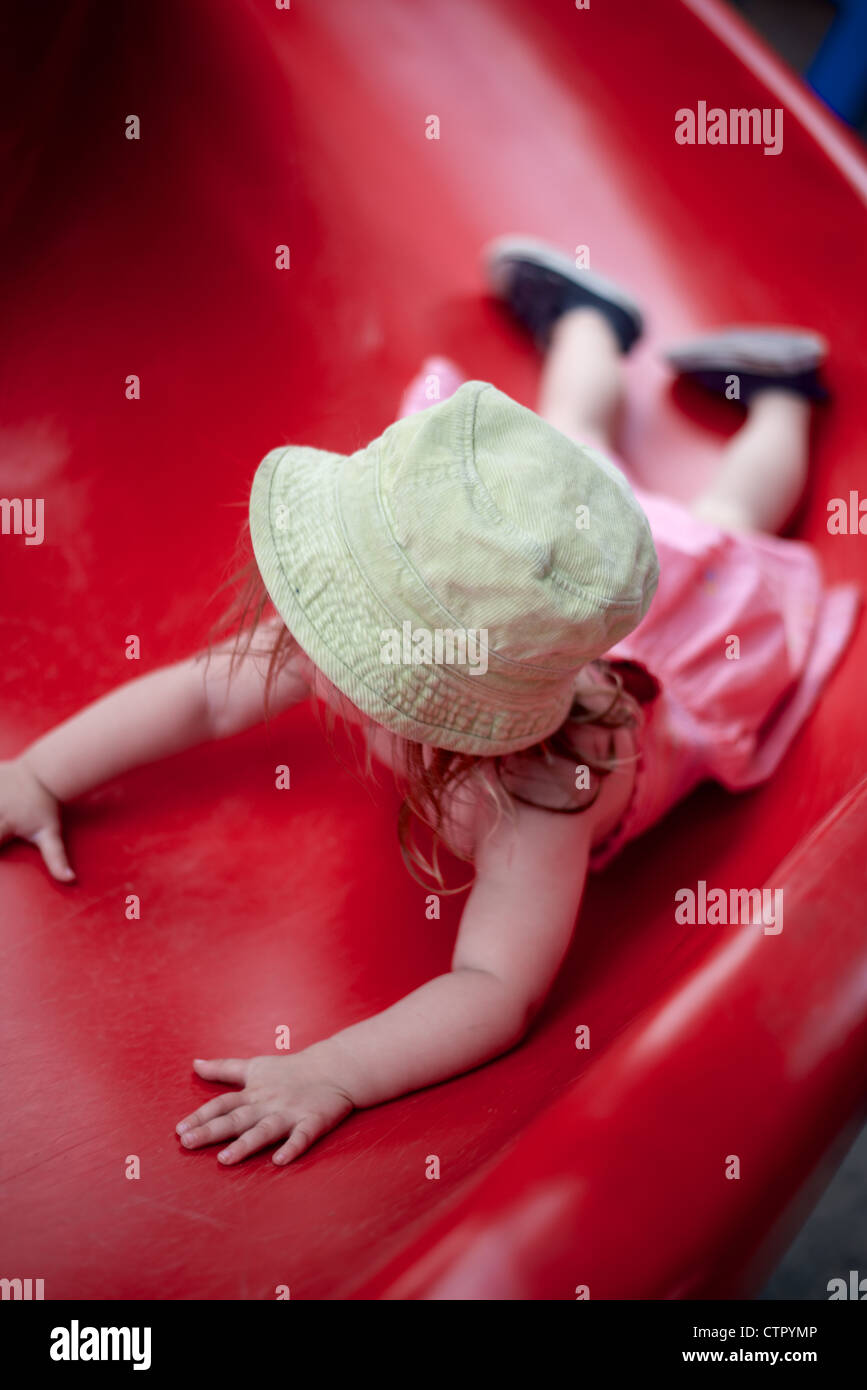 Girl head first slide hi-res stock photography and images - Alamy