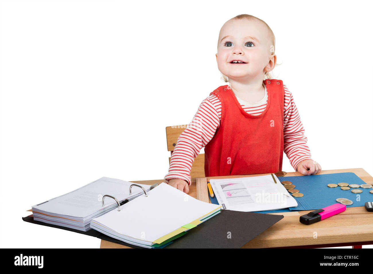 young child working at writing desk in light background Stock Photo - Alamy