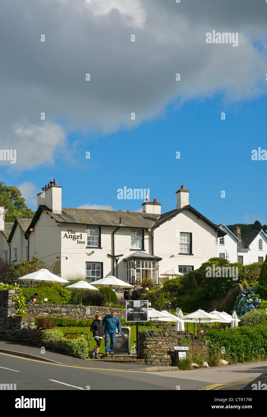 Drinkers sitting in the beer garden of the Angel Inn, Bowness-on ...