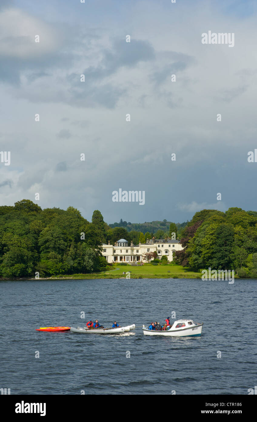 A flotilla of small craft passing Storrs Hall Hotel, Lake Windermere ...
