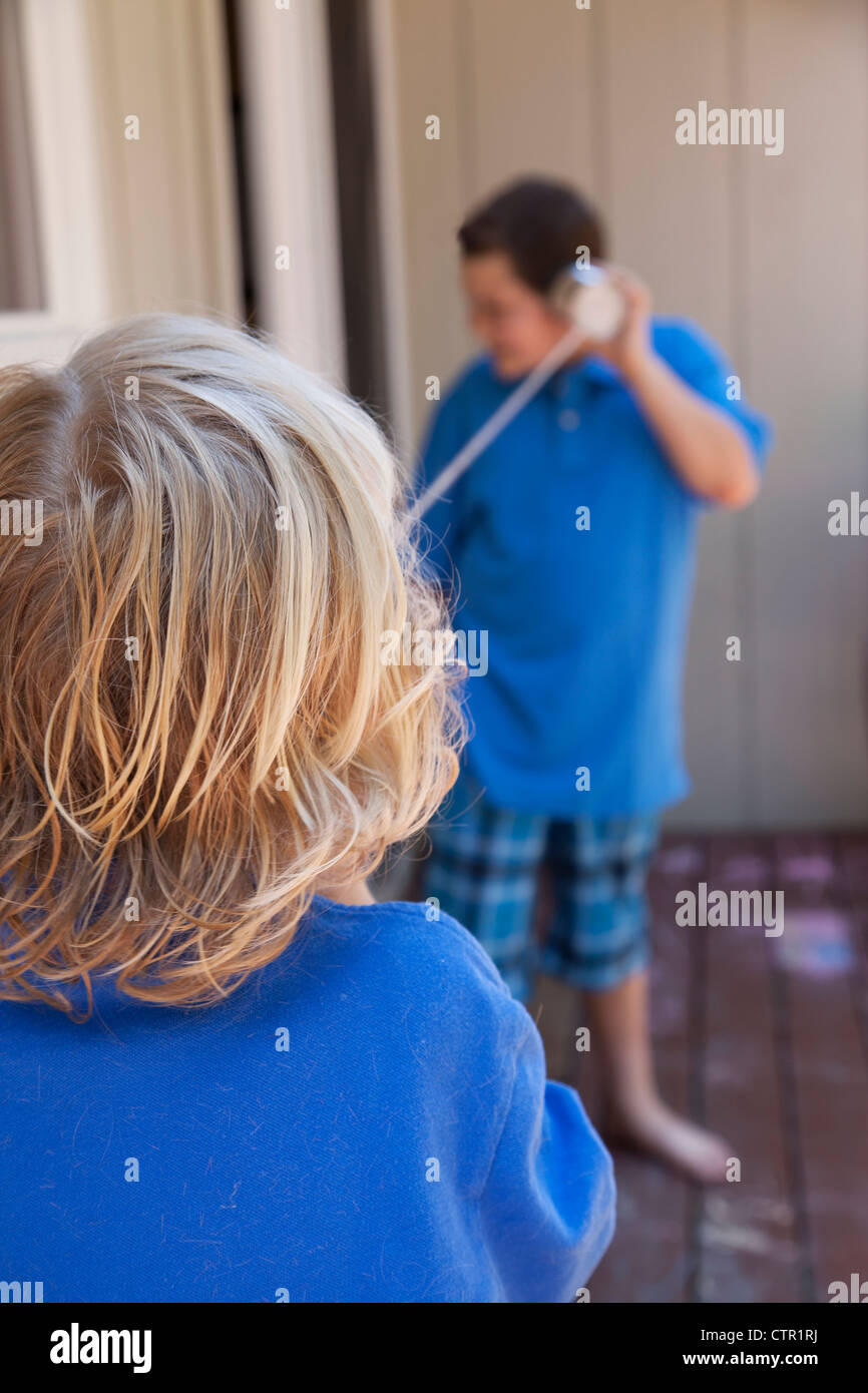 Two boys talking string can hi-res stock photography and images - Alamy
