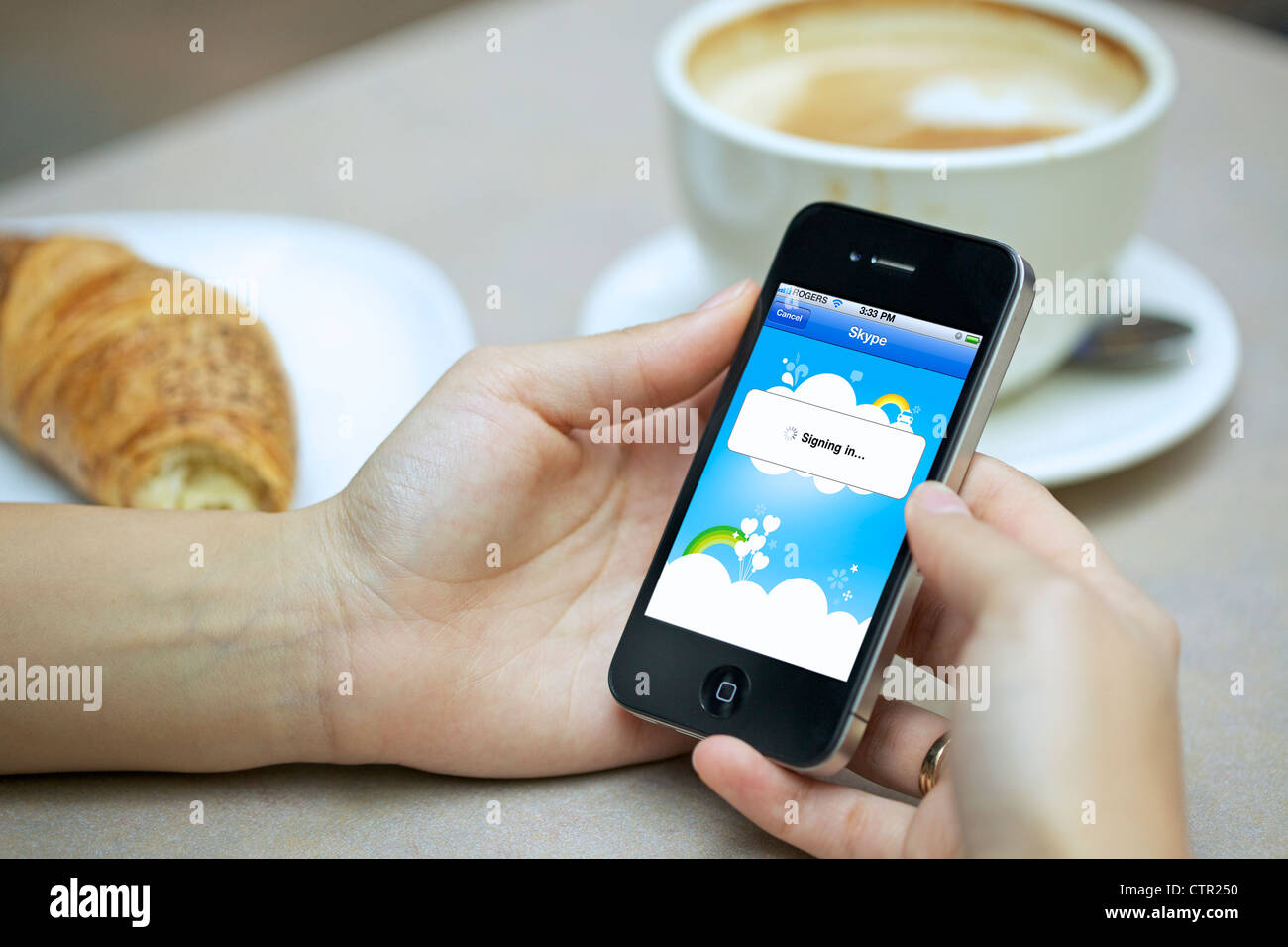 Close up picture of woman handholding an iphone logging in on her ...